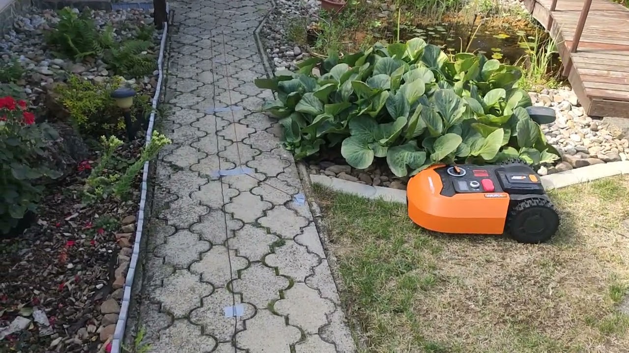 worx landroid crossing a narrow walkway | Robot Maniak